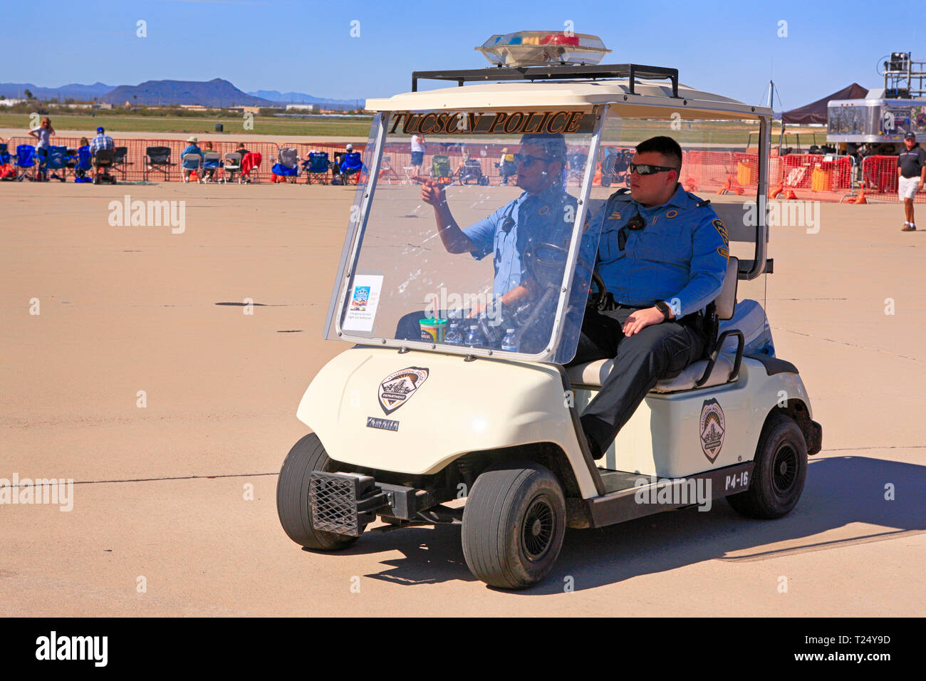 Police officers of the Tucson Police Department patrol in a golf buggy ...