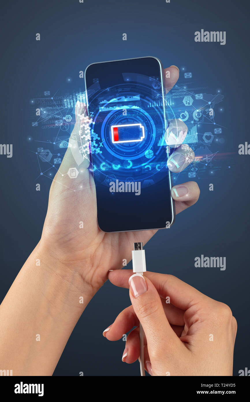 Elegant hand charging smartphone with global report concept Stock Photo ...
