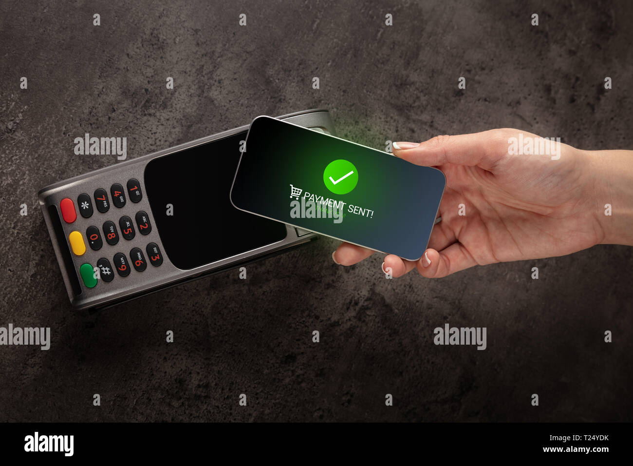 Mobile payment accepted on terminal Stock Photo - Alamy