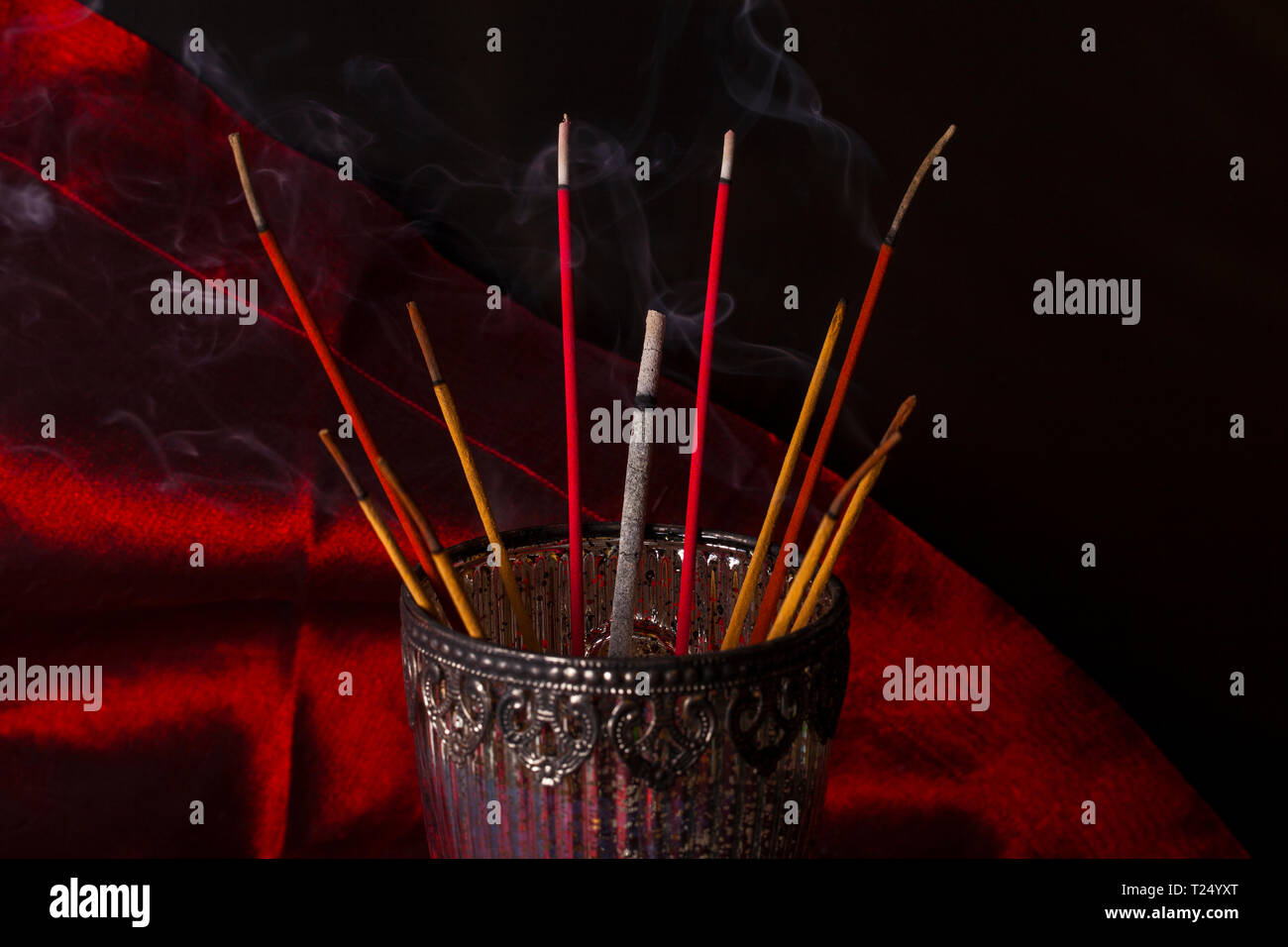 Burning aromatic incense sticks Stock Photo - Alamy
