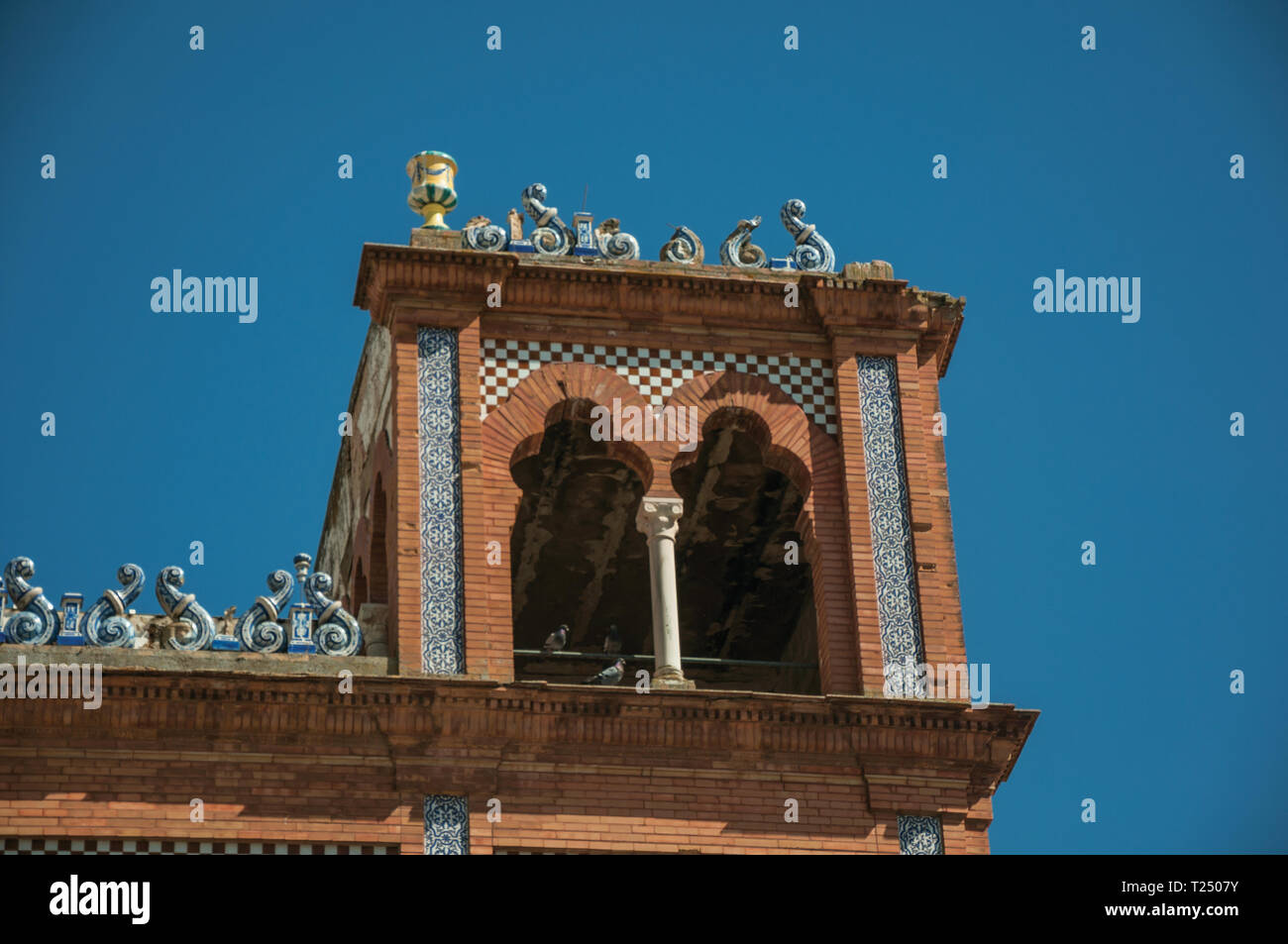 Tower on building facade in eclectic style with ceramics and bricks ...