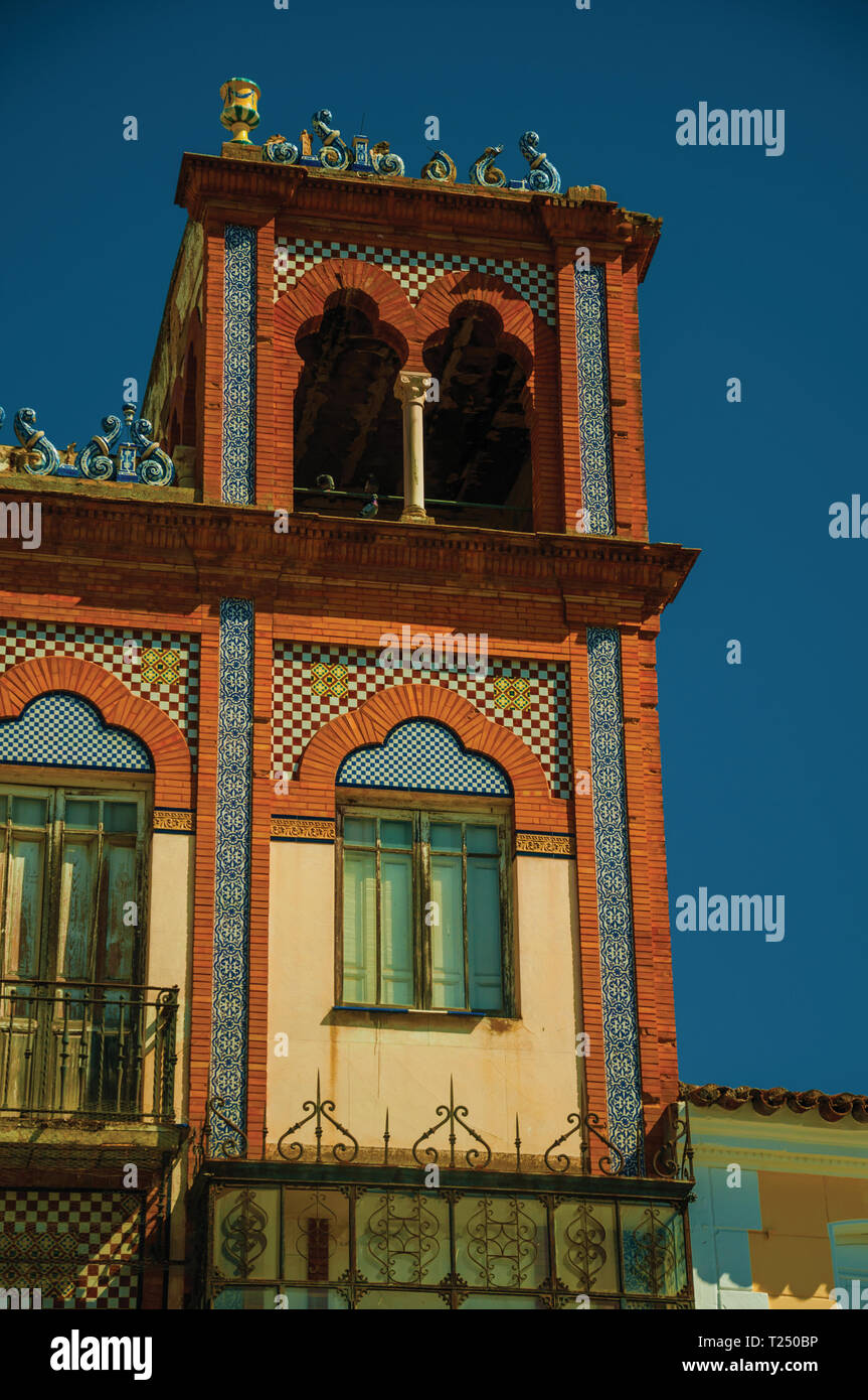 Tower on building in eclectic style with ceramic and bricks details at ...