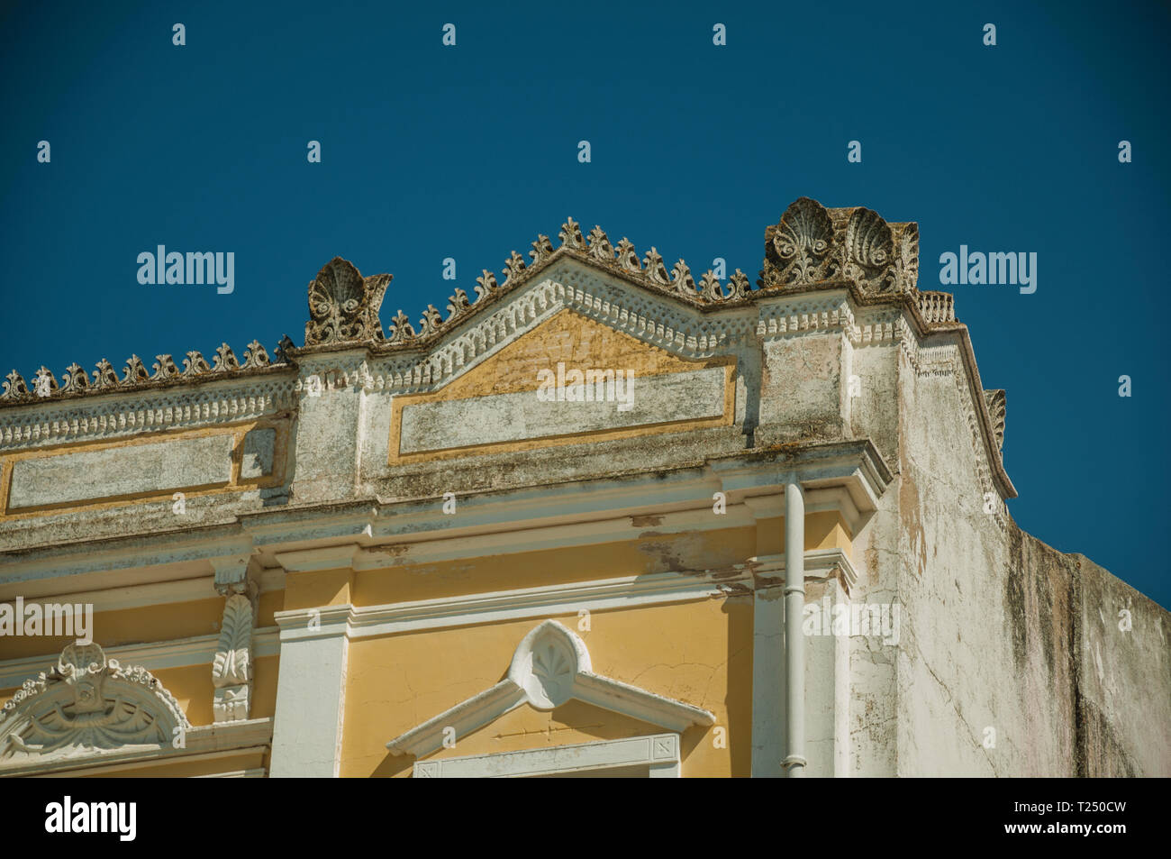 Masonry and plaster ornaments on top of building facade in eclectic ...