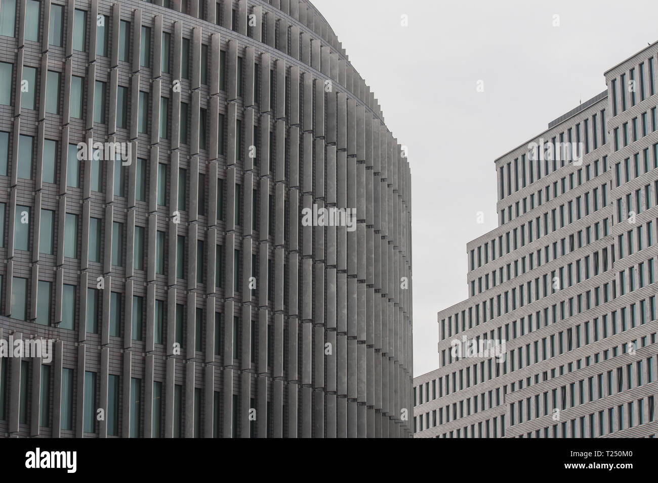 two buildings in Berlin, Germany, with with rectangular and circular ...