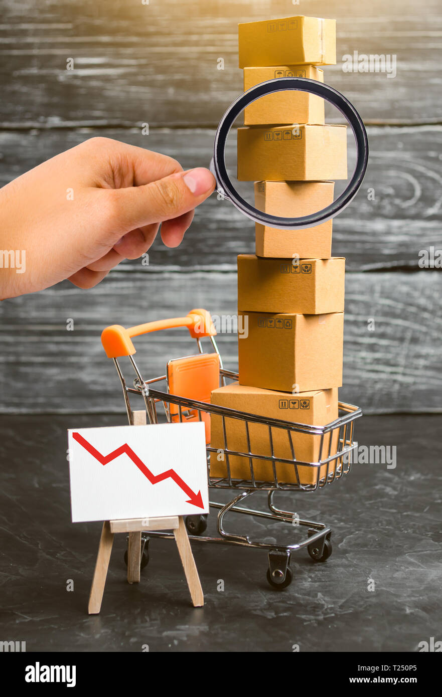 Magnifying glass is looking at the supermarket cart loaded with lots of ...