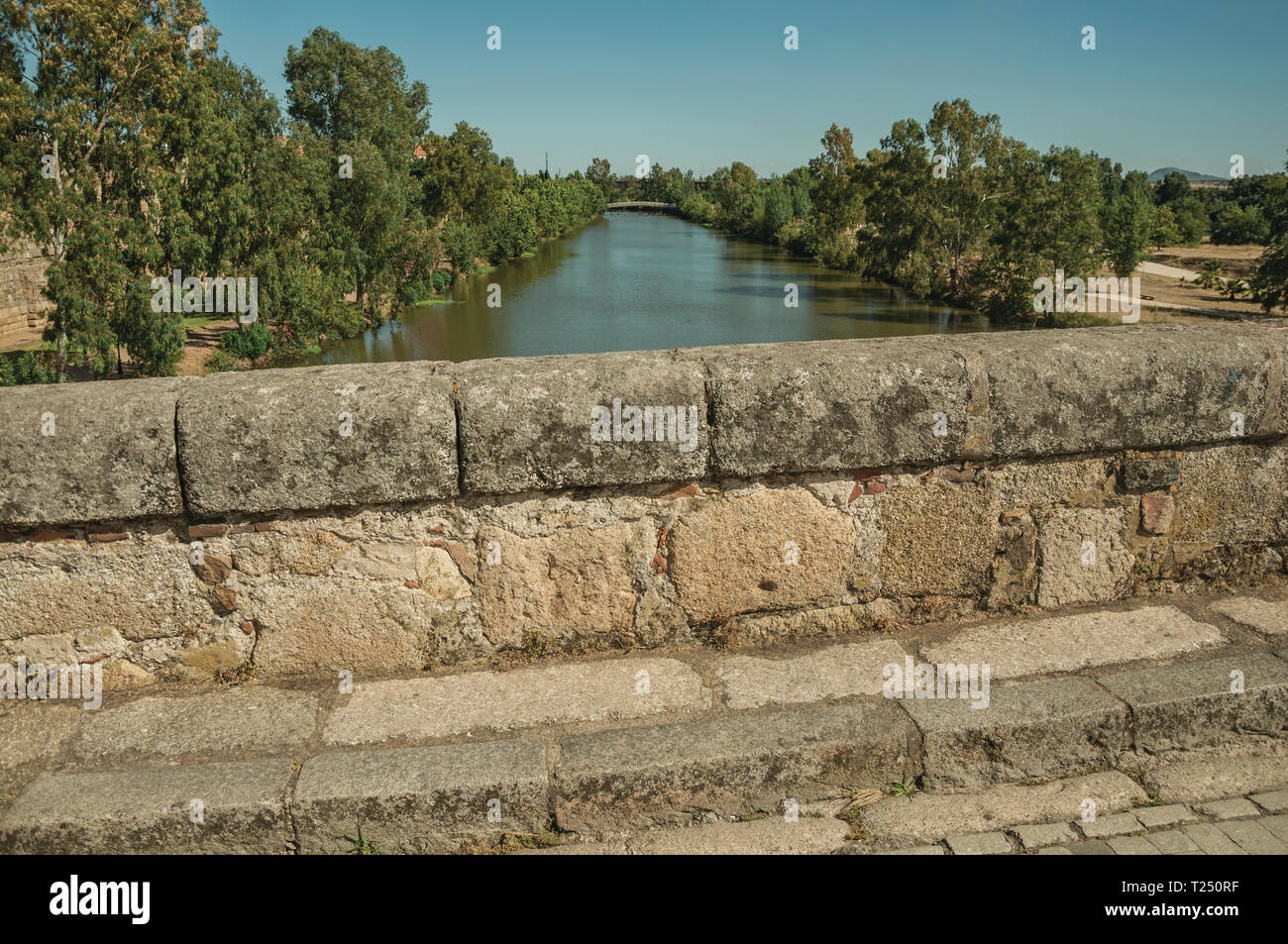 Stone parapet on top of Puente Romano, an ancient bridge over the ...