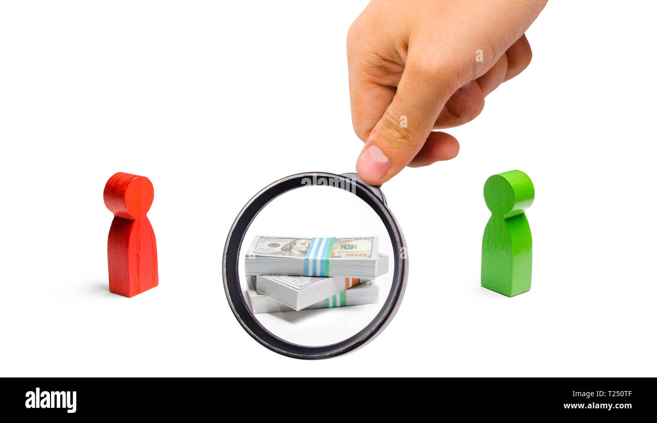 Magnifying glass is looking at a bunch of money between two persons ...