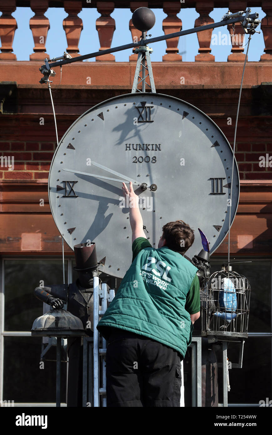 ZSL London Zoo trainee keeper Jasmine Sinclair make adjustments to the ...
