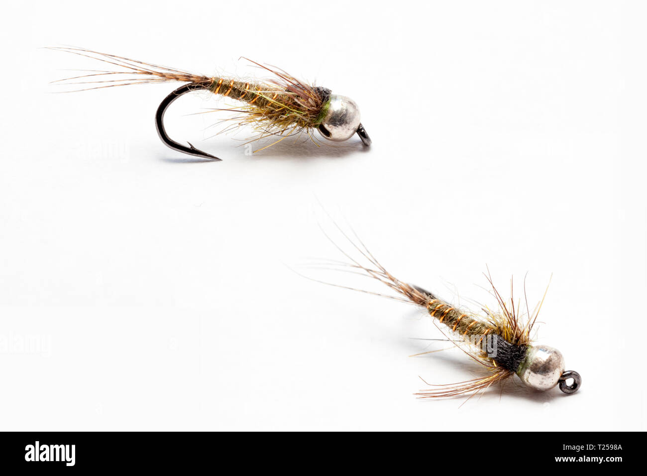 fly fishinig, fly tying hooks close up Stock Photo - Alamy