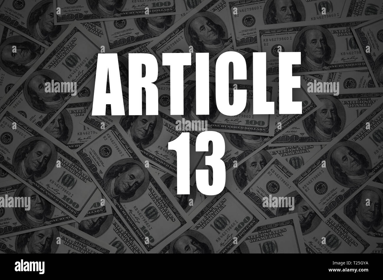 Article 13 inscription and many hundred dollar bills in dark background ...