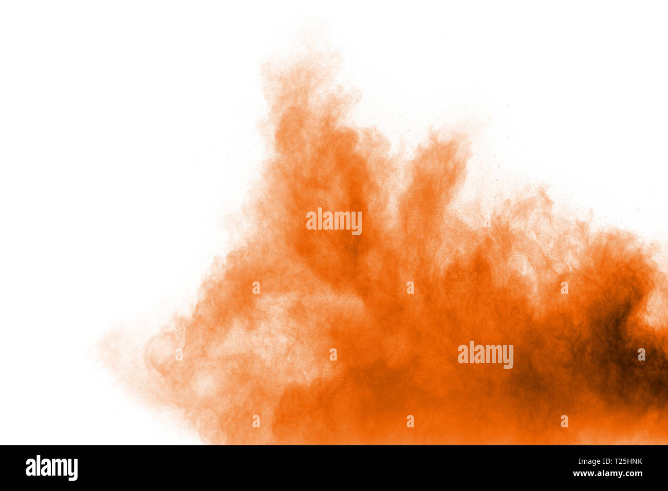 Abstract explosion of orange dust on white background. Freeze motion of ...