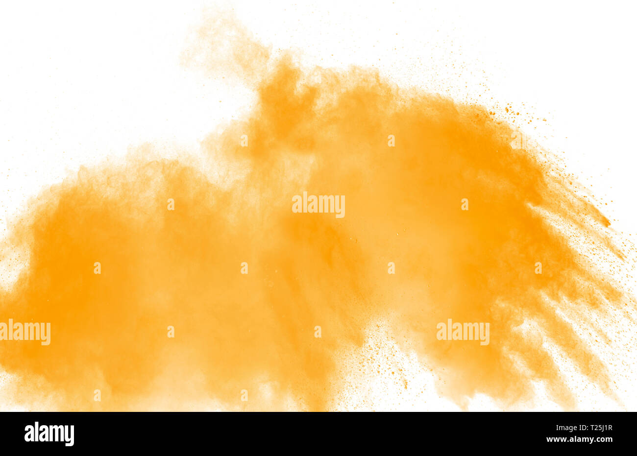 Abstract yellow orange powder explosion on white background. Freeze ...