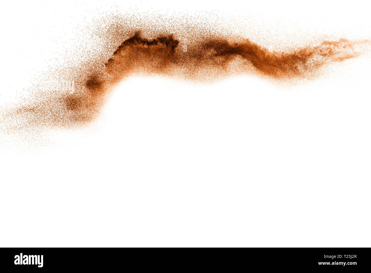 Brown particles splattered on black background. Brown dust splashing ...