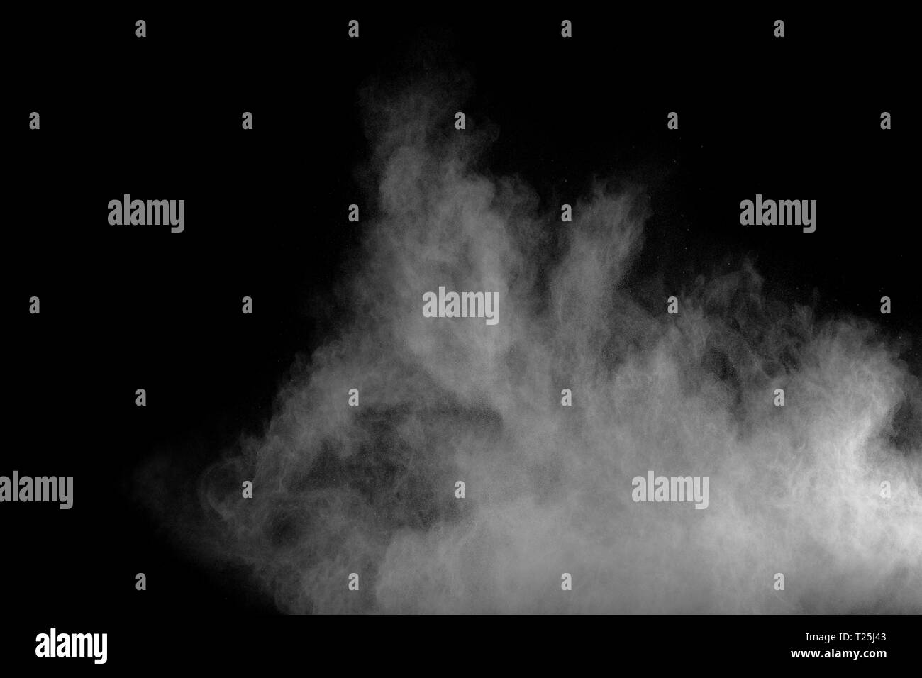 White powder explosion.Freeze motion of white dust particles on black ...