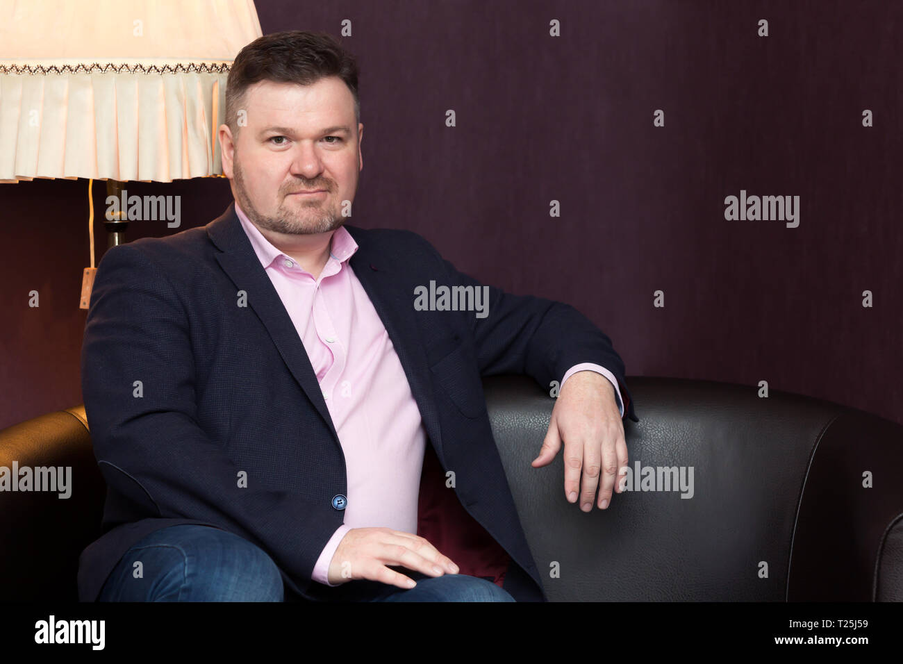 Fat man sitting on couch hi-res stock photography and images - Alamy