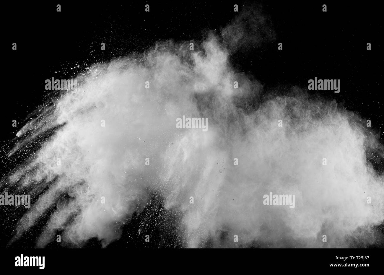 White powder explosion.Freeze motion of white dust particles on black ...