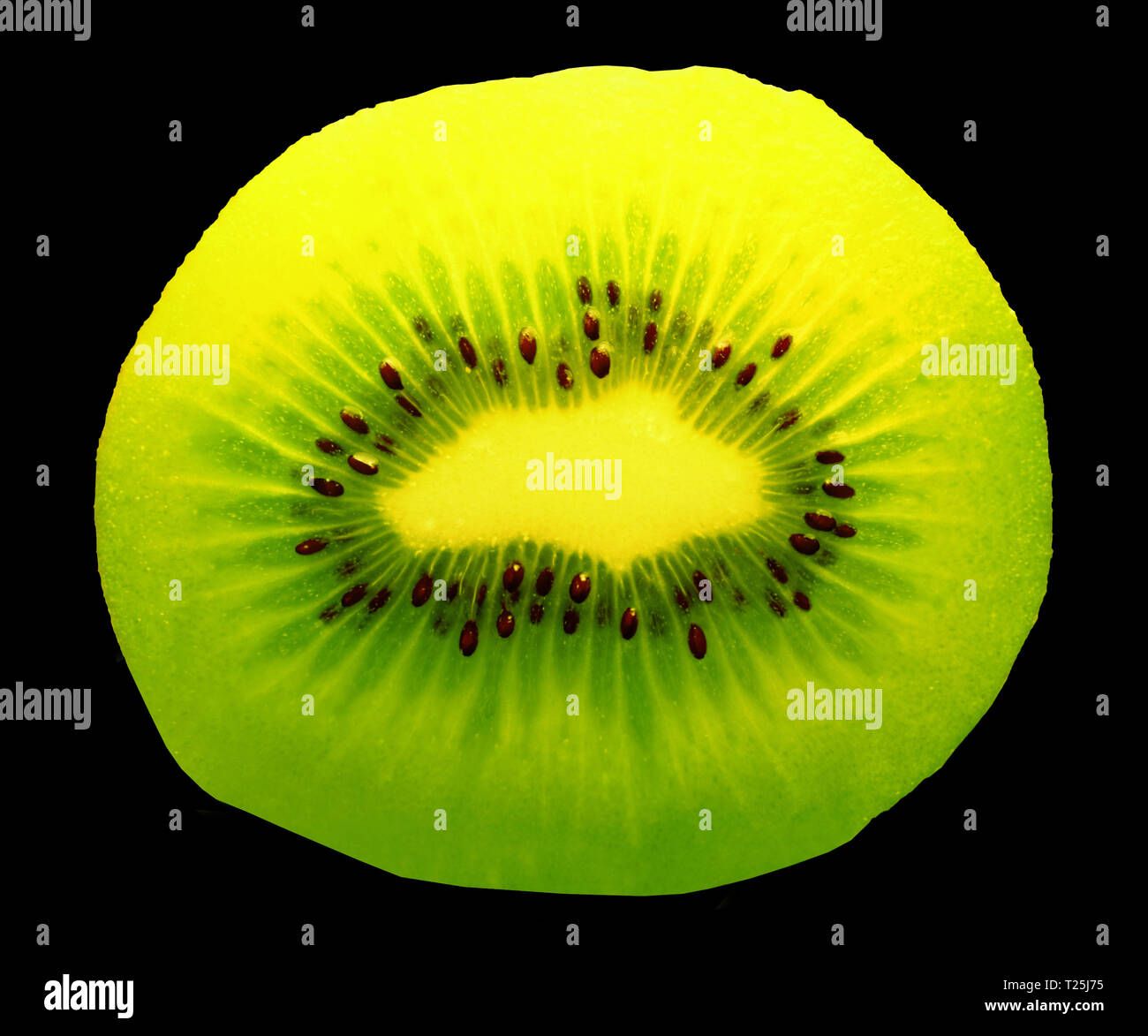 closeup of a kiwi fruit inside with seeds on dark background Stock ...