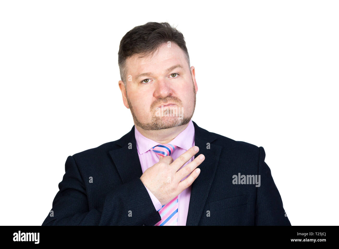 A fat middle-aged man with a beard straightens his tie around his neck ...