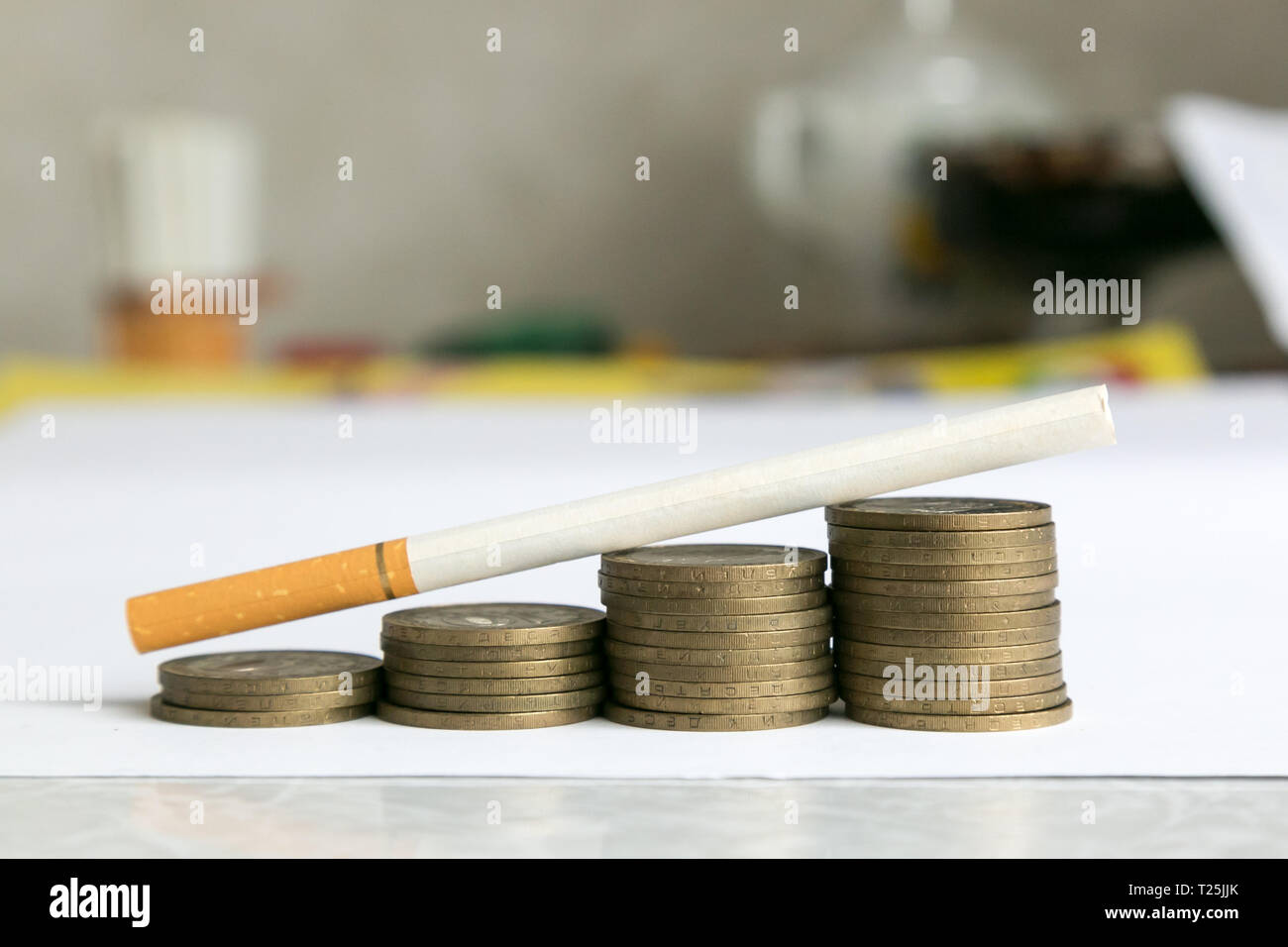 Graph increasing the cost of cigarettes and tobacco on a white ...