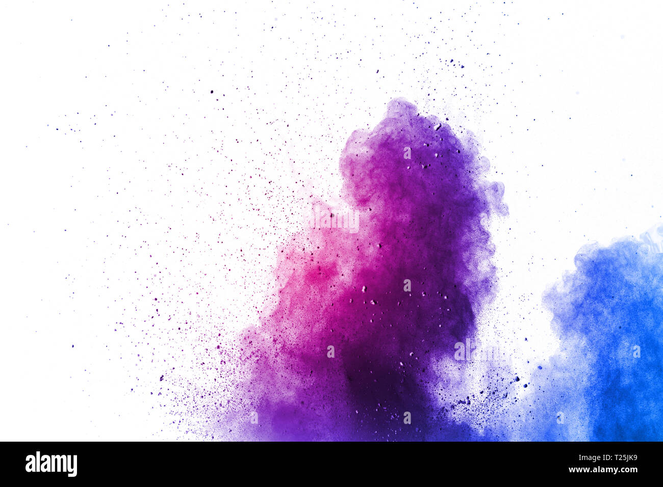 Purple color powder explosion cloud on white background.Closeup of ...