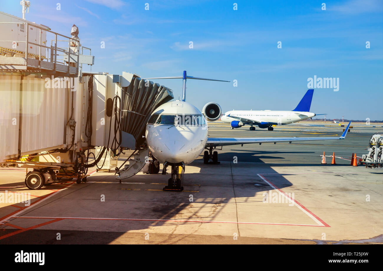 Front view of landed airplane in a terminal of aircraft at the ...