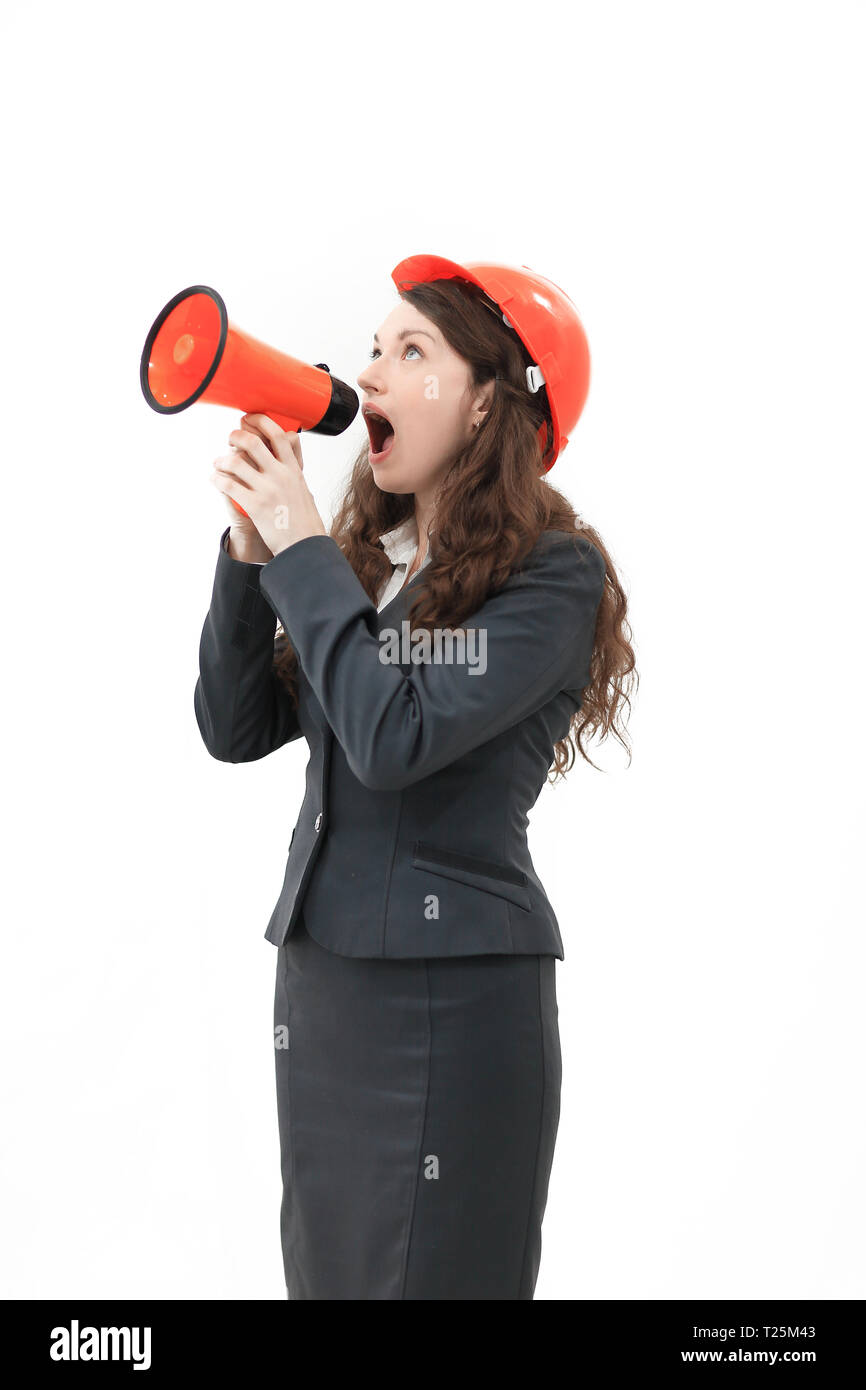 confident female architect - engineer shouts into a megaphone a ...