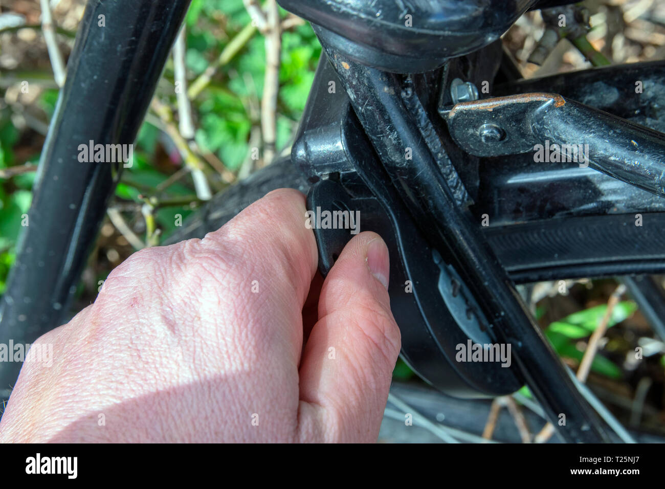 Locking his bicycle hi-res stock photography and images - Alamy