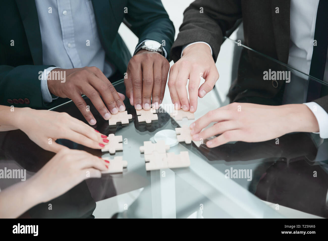 close up .multinational business team assembling puzzle Stock Photo - Alamy close up .multinational business team assembling puzzle Stock Photo - Alamy