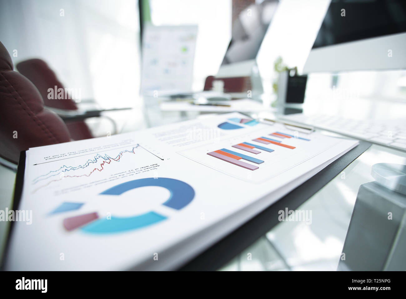 closeup.financial chart on the table from a businessman Stock Photo - Alamy