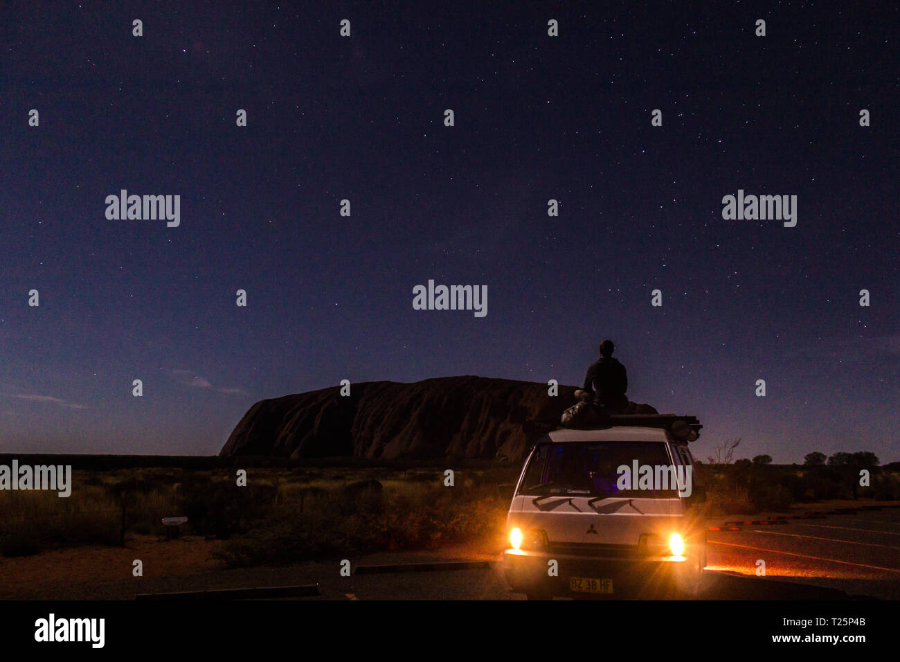 Uluru at night with car in front, ayers Rock, the Red Center of ...