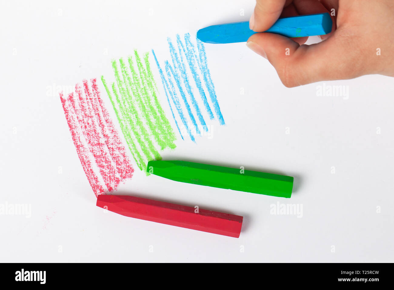Close up of artists hand painting with crayon, art Stock Photo - Alamy