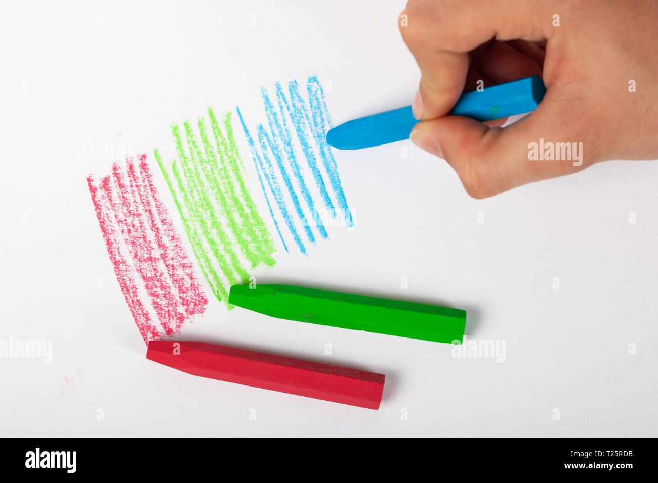 Close up of artists hand painting with crayon, art Stock Photo - Alamy