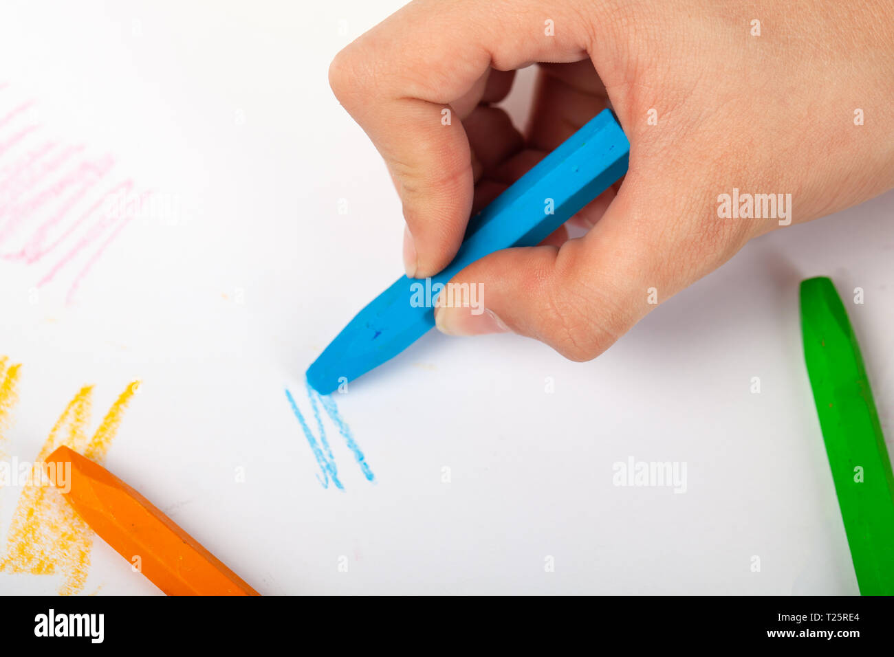 Close up of artists hand painting with crayon, art Stock Photo - Alamy