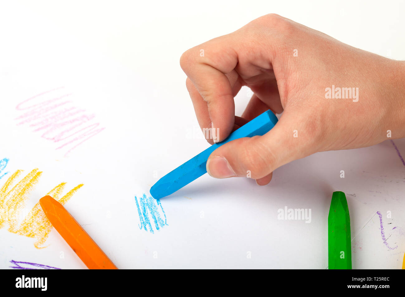 Close up of artists hand painting with crayon, art Stock Photo - Alamy