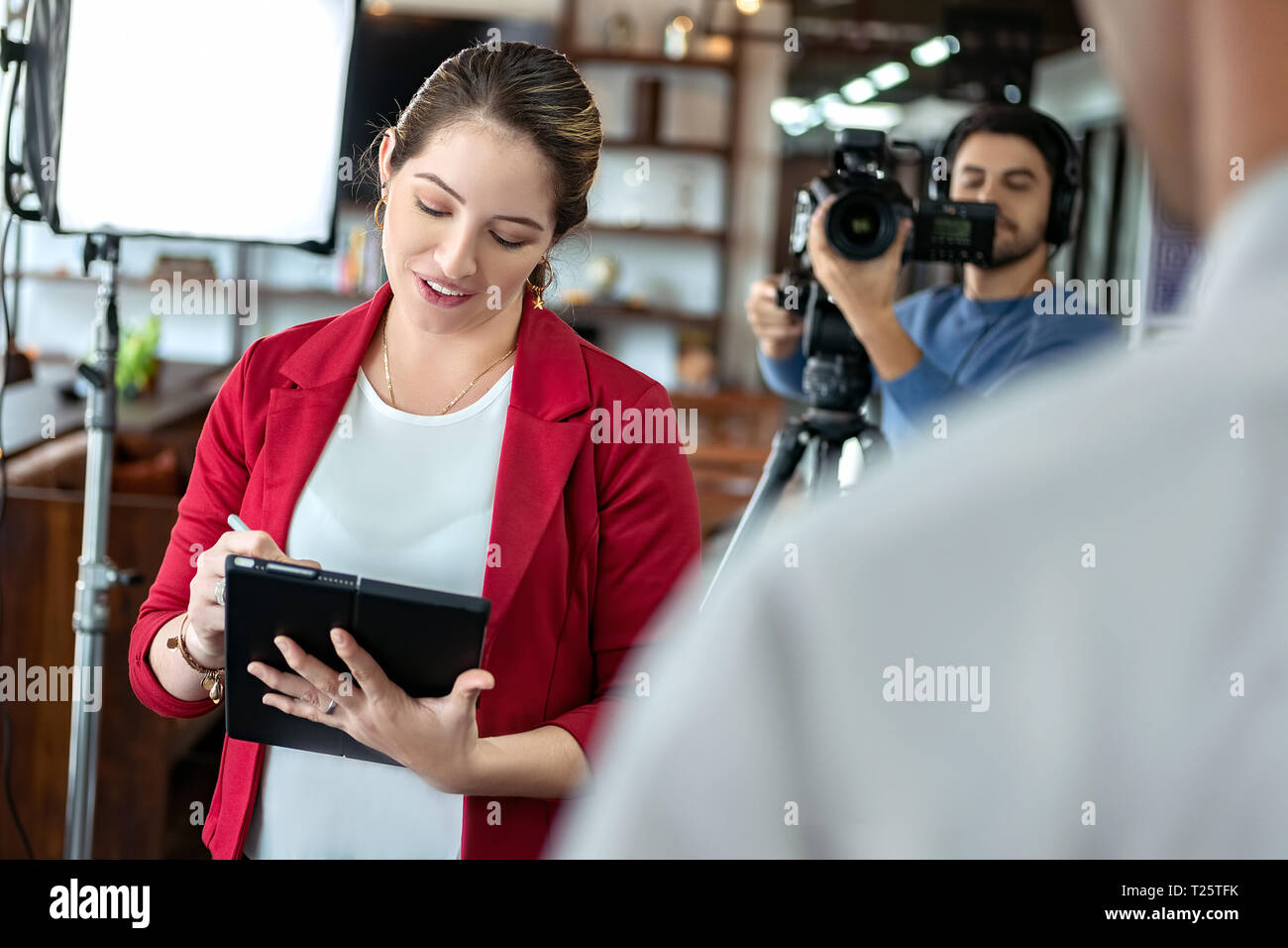 Happy businessman during corporate interview with female journalist ...