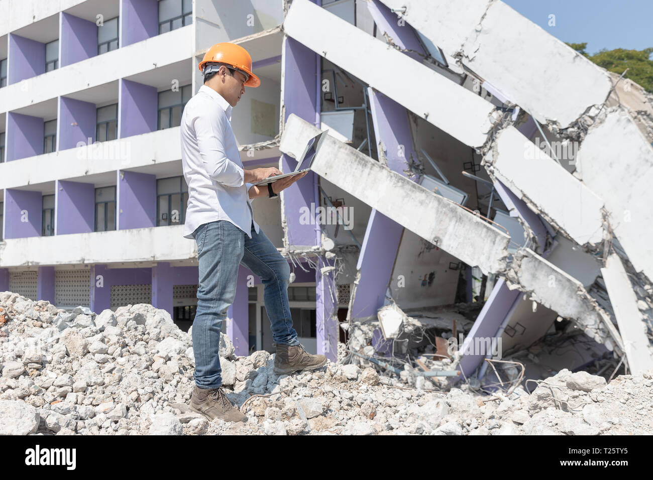 Engineer architect and worker operation control demolish old building ...