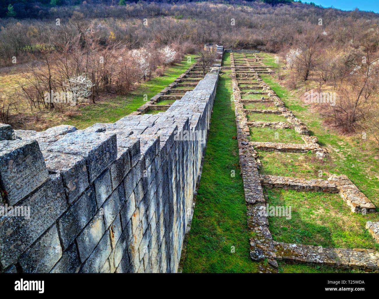 Solid stone wall and ruins of ancient fortress Stock Photo - Alamy
