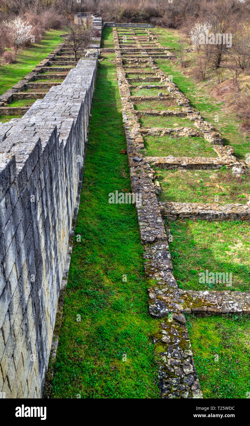 Solid stone wall and ruins of ancient fortress Stock Photo - Alamy