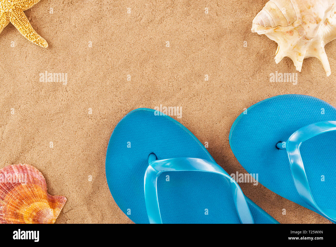 Flip flops in the sand at the beach Stock Photo - Alamy