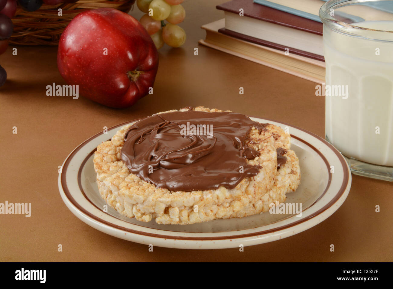 Rice cakes with hazelnut cocoa spread and a glass of milk Stock Photo ...