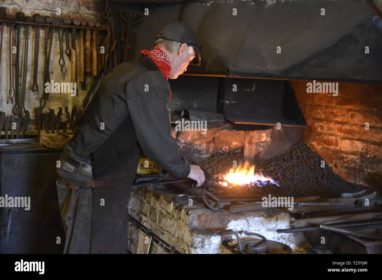 Blacksmith working in The Forge at Milton Keynes Museum, Wolverton and ...