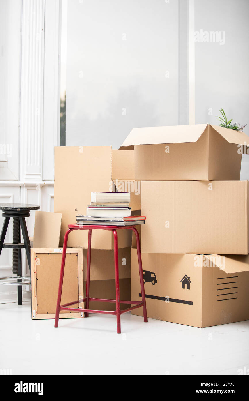 Cardboard boxes on the floor in new home Stock Photo - Alamy