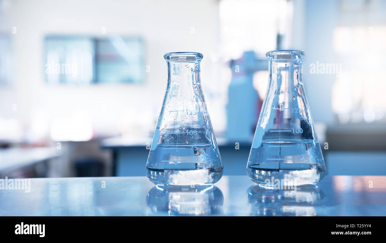 two glass flask with water in chemical science laboratory education ...