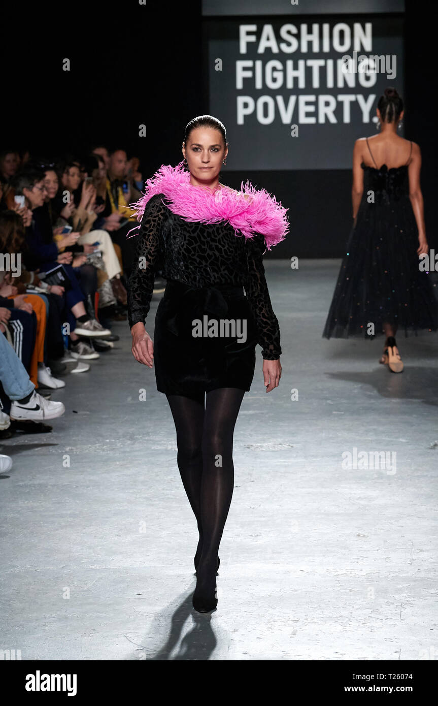 Models walking on the catwalk during the Fashion Fighting for Poverty ...