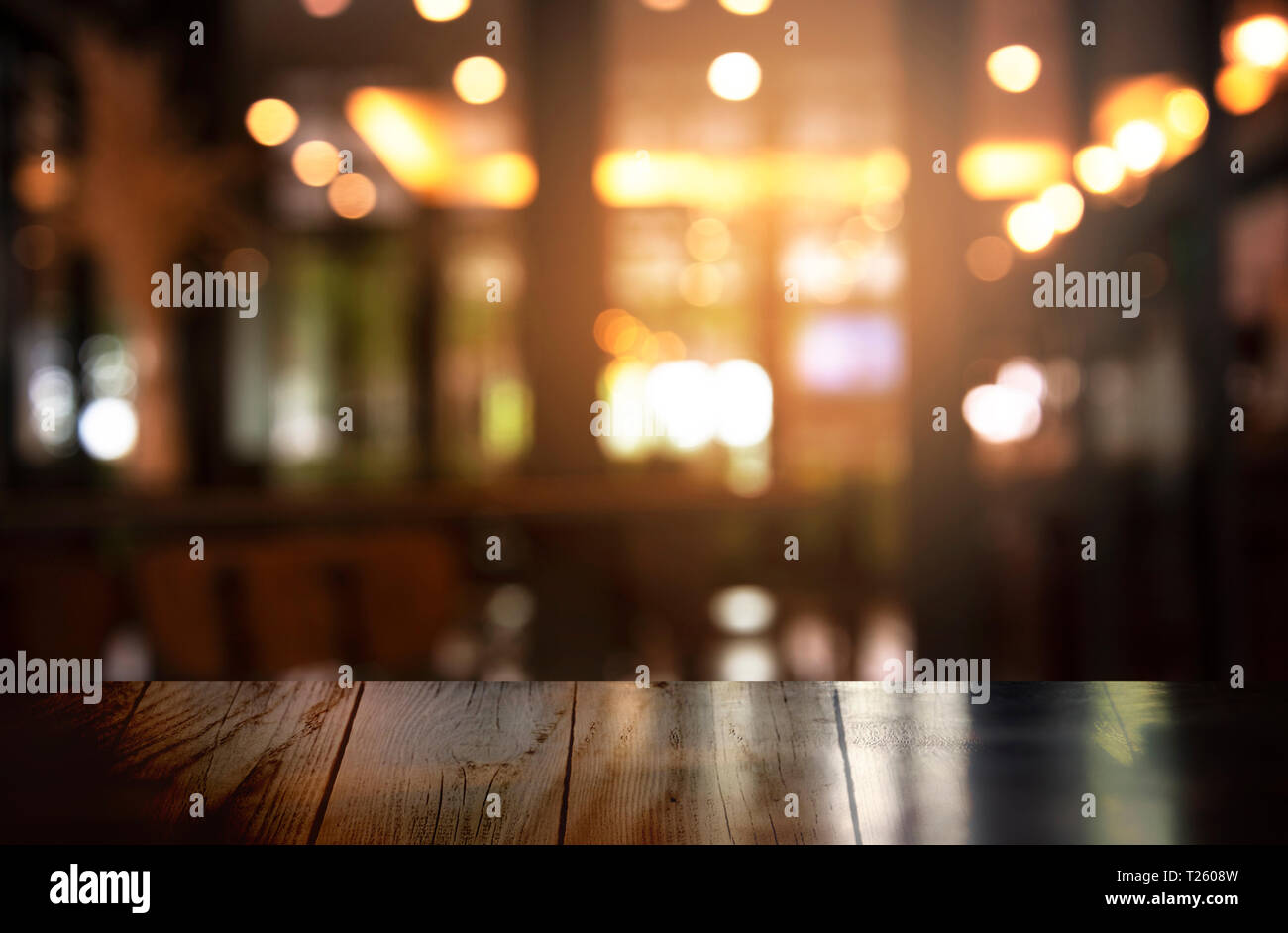 top of wood table with blur bar or pub light city party dark night ...