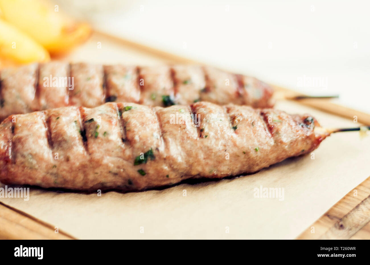 grilled minced meat with herbs, traditional Greek lunch in a restaurant ...