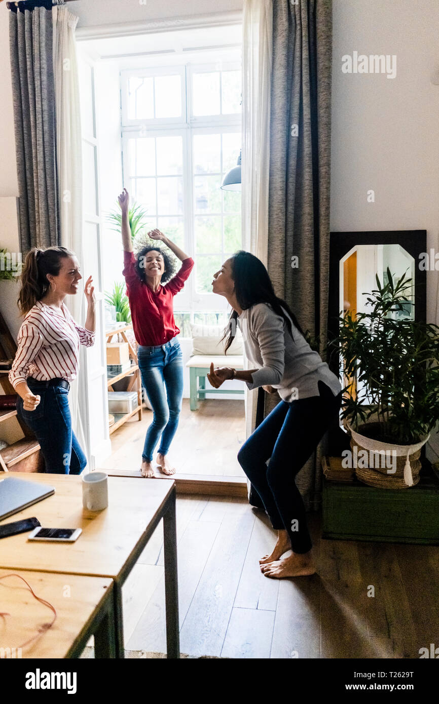 Three friends at home, living together Stock Photo - Alamy