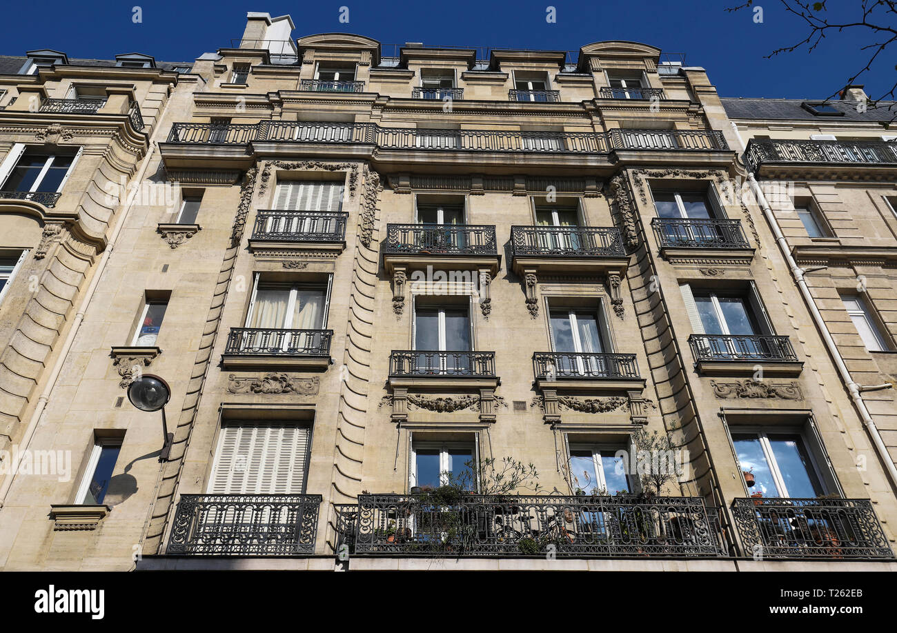 Traditional French house with typical balconies and windows. Paris ...