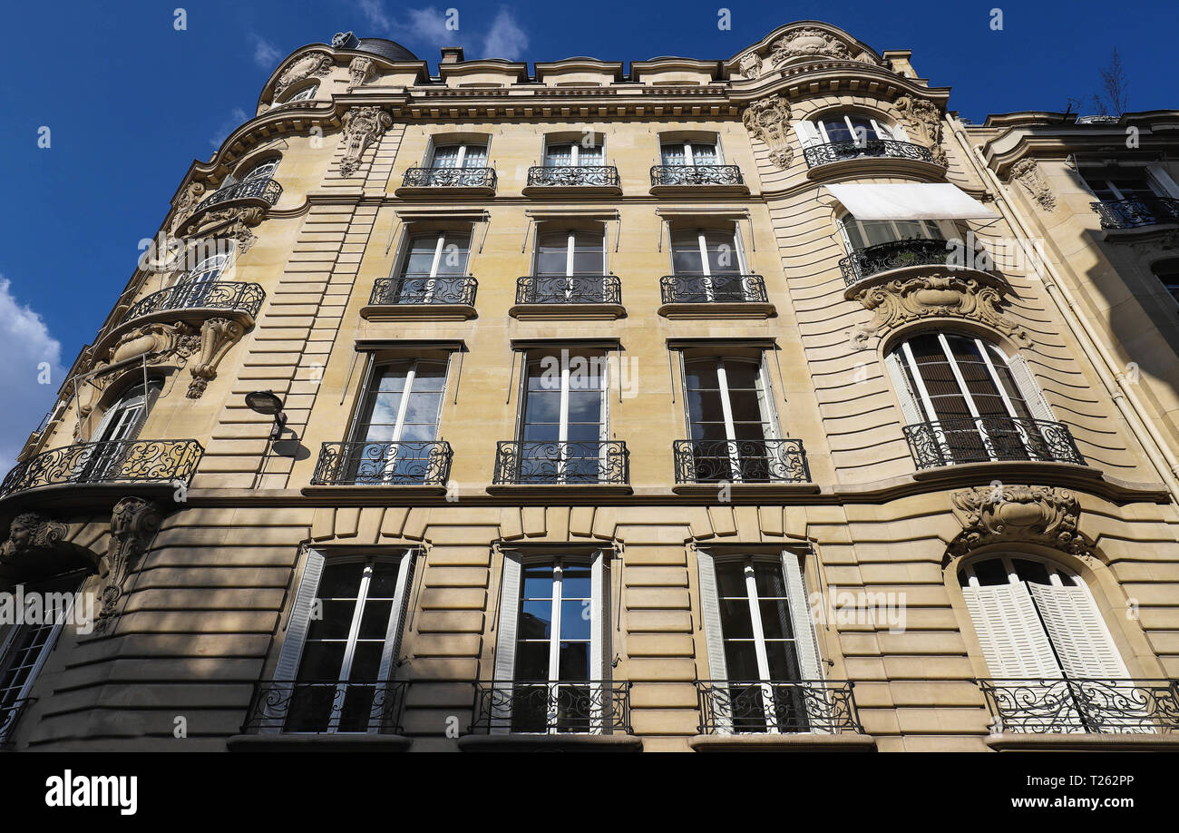Traditional French house with typical balconies and windows. Paris ...