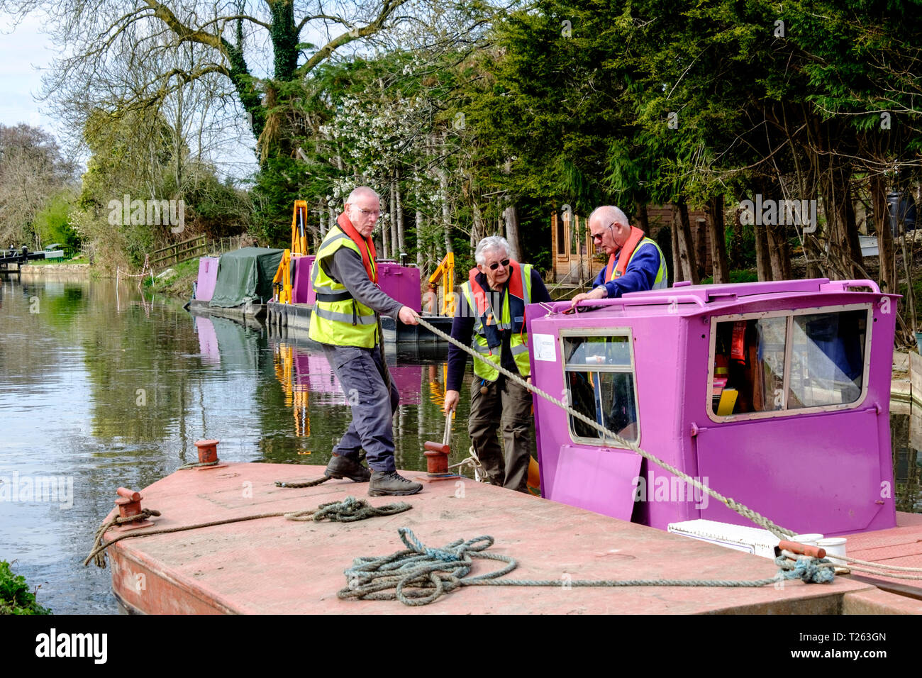 Volunteers work along the Stroudwater Navigation, a canal near Stroud ...